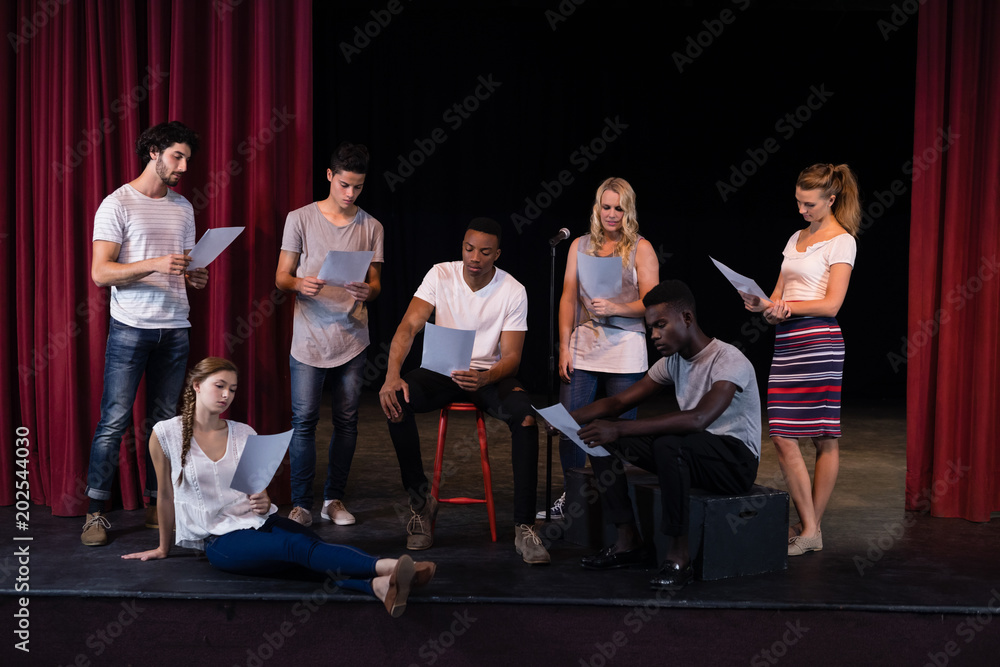 Actors reading their scripts on stage Stock Photo | Adobe Stock
