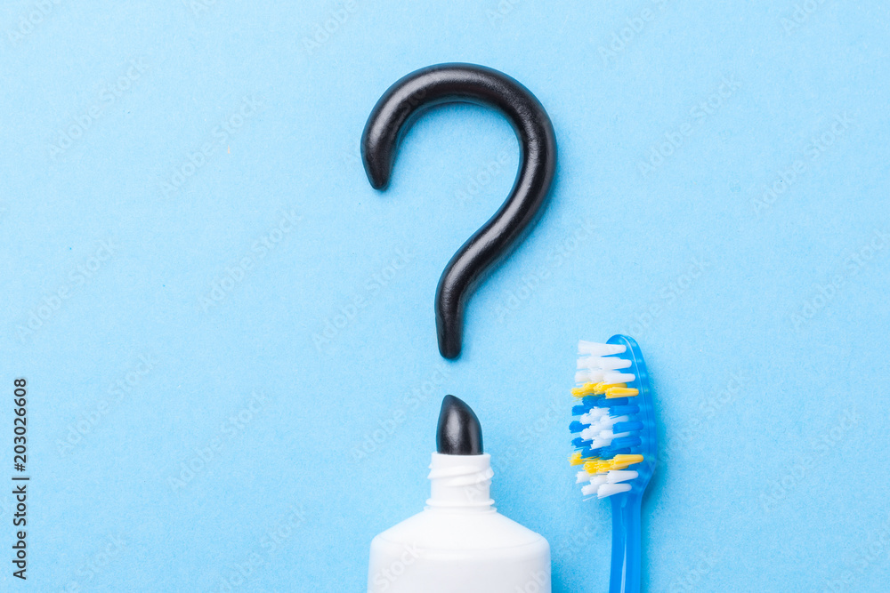 Black toothpaste from charcoal for white teeth. Tooth-paste in the form ...