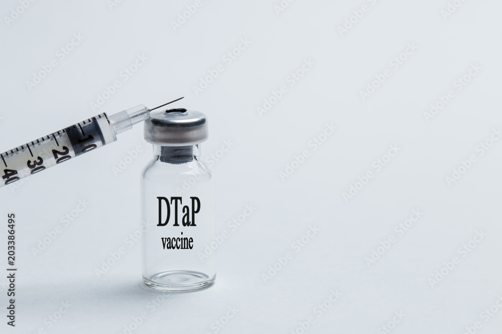 Vaccine from diphtheria, tetanus and whooping cough in a vial and a ...