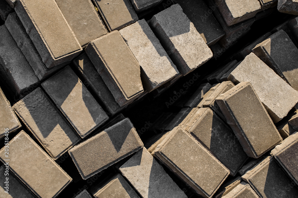 Sun beams on a concrete paving slabs. Background of paves, lying in an ...