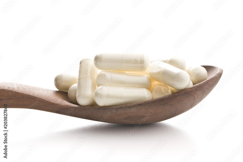 White medicine capsules. Stock Photo | Adobe Stock