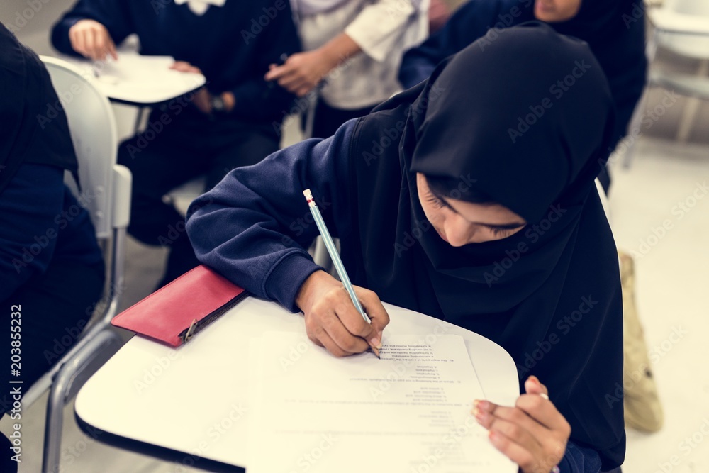 diverse muslim children studying in classroom Stock Photo | Adobe Stock