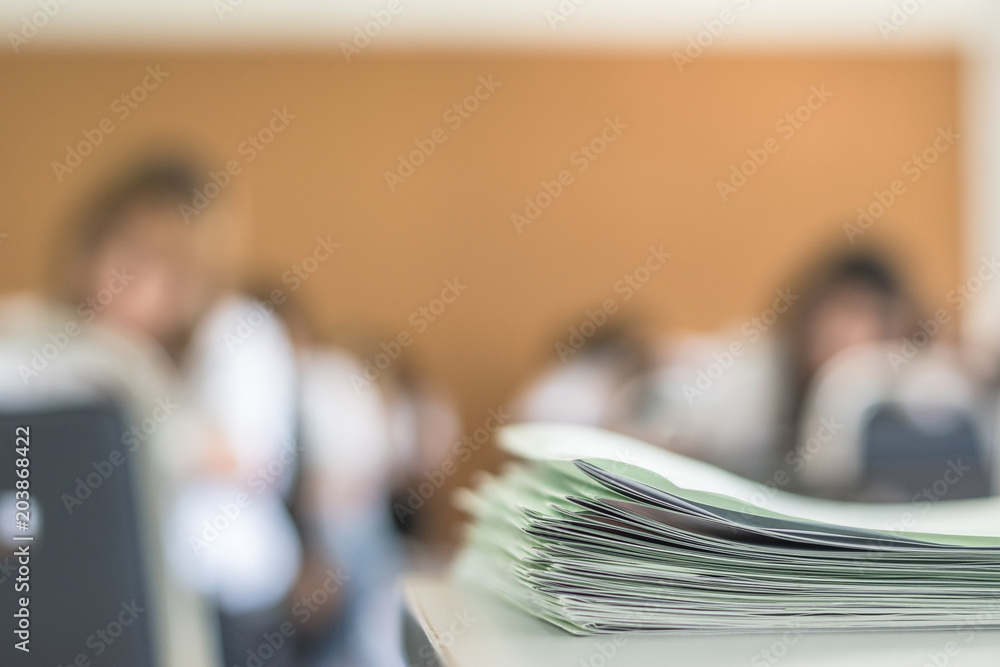 Exam answer sheet or application paper blurry view on table in ...