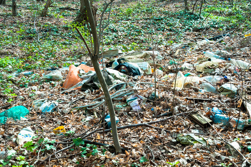 Garbage and junk in the forest nature pollution and littering Stock ...