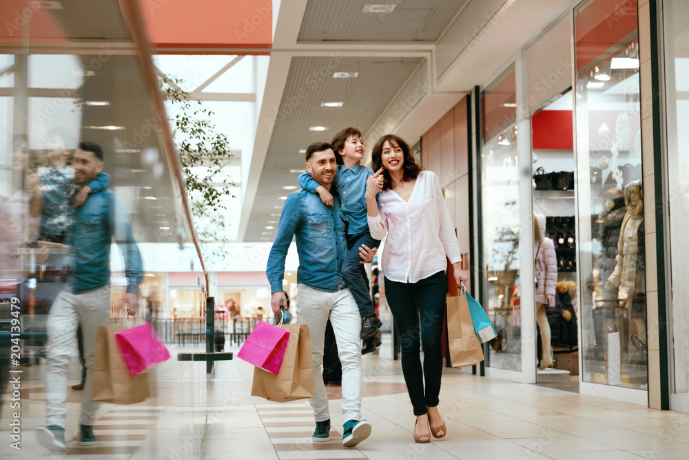 Family Shopping. Happy People In Mall Stock Photo | Adobe Stock