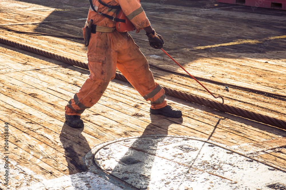 Anchor-handling Tug Supply AHTS vessel crew preparing vessel towing ...