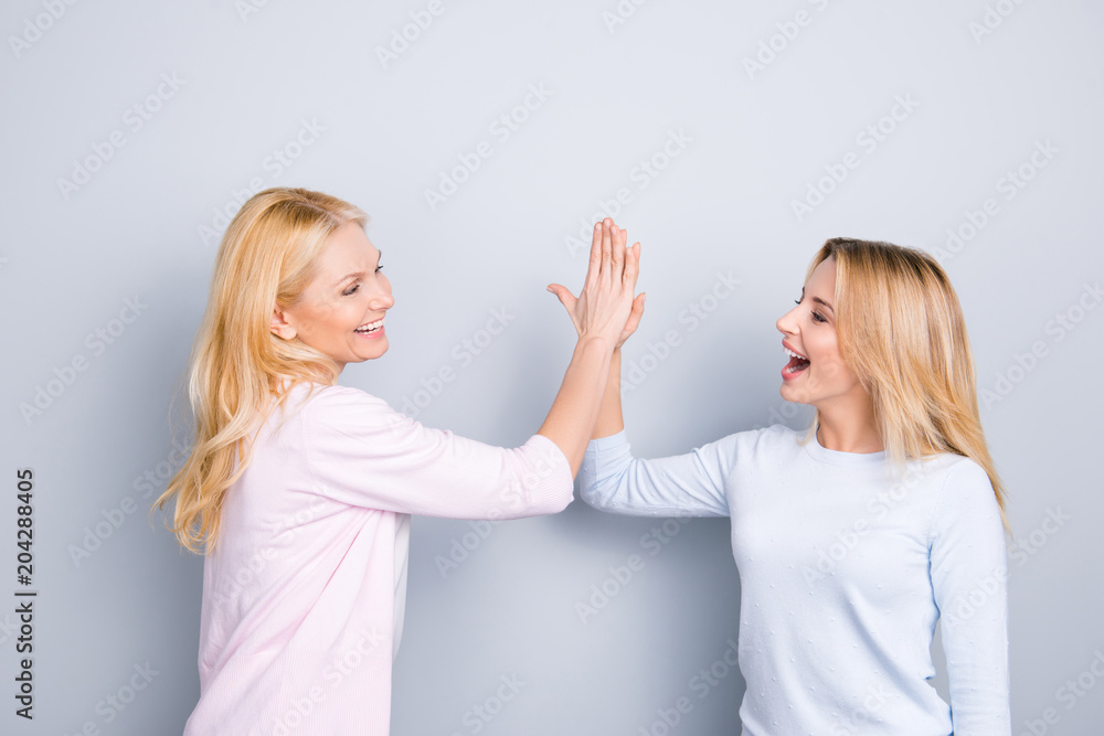 Give me high five, mother and daughter celebrating victory win, holding ...