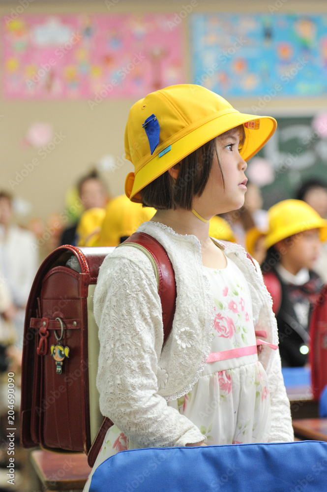 First day of a beautiful little girl in Japanese Elementary School. In ...