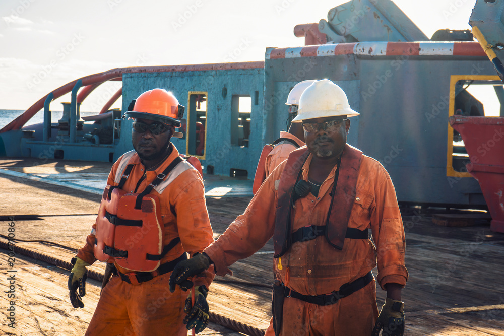 Anchor-handling Tug Supply AHTS vessel crew preparing vessel for static ...