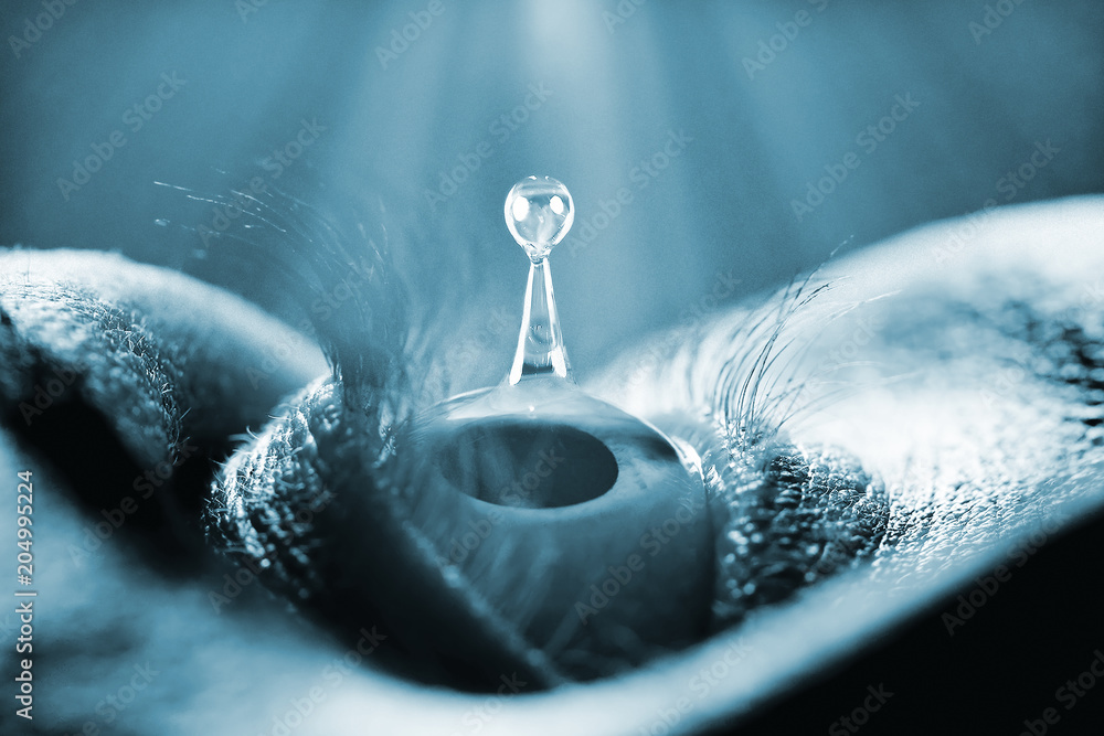 Macro closeup on eye with liquid drop Stock Photo | Adobe Stock
