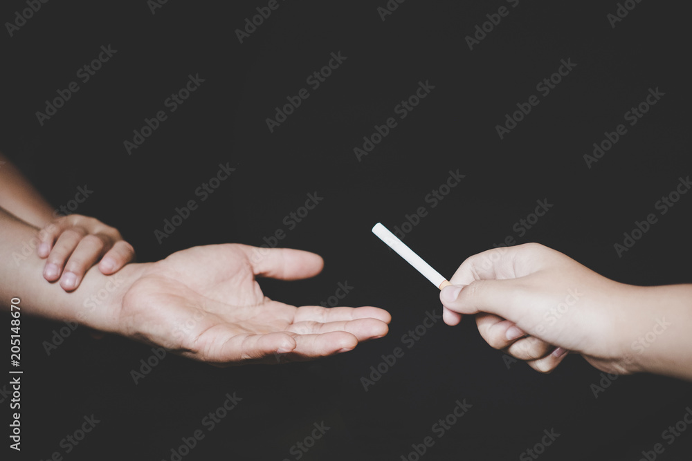 Daughter hand touch father's hand, do not smoke. STOP Smoking. World no ...