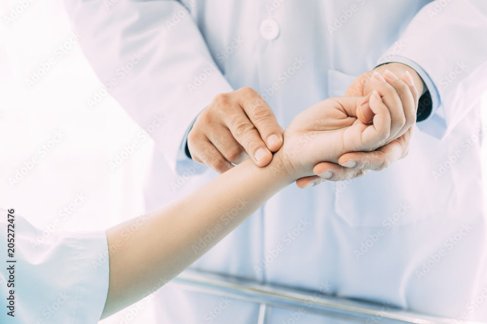 Doctor with patient. Routine health check and holding hands. Male ...