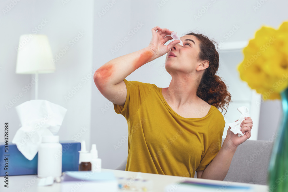 Annoying allergy. Young allergic girl performing complex self medical ...