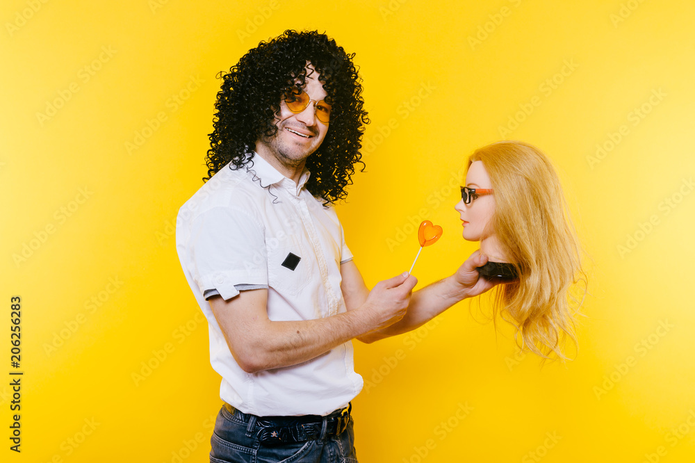 Excited bizarre strange odd foolish guy have fun with plastic mannequin ...