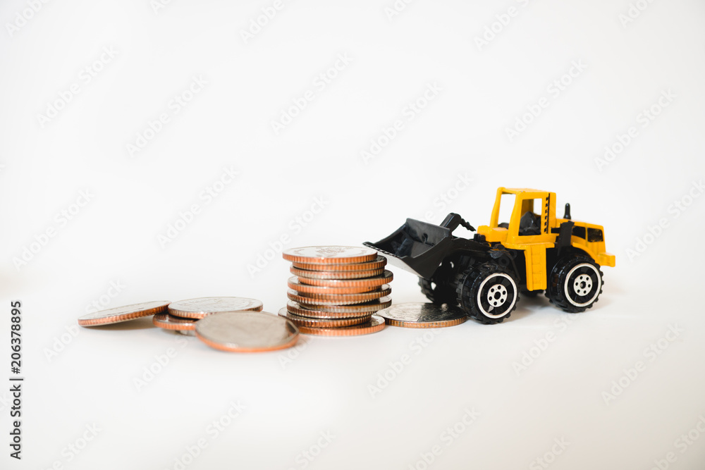 Miniature tractor with golden stack coins using as business and ...