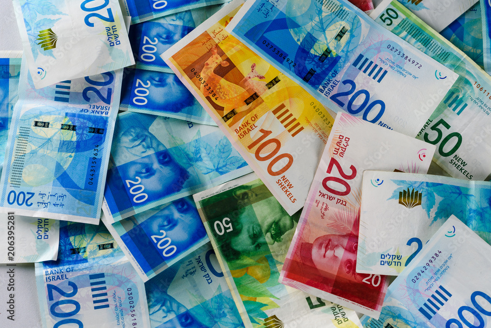 Pile of NIS - New Israeli Shekels banknotes with the new 200, 100, 20 ...