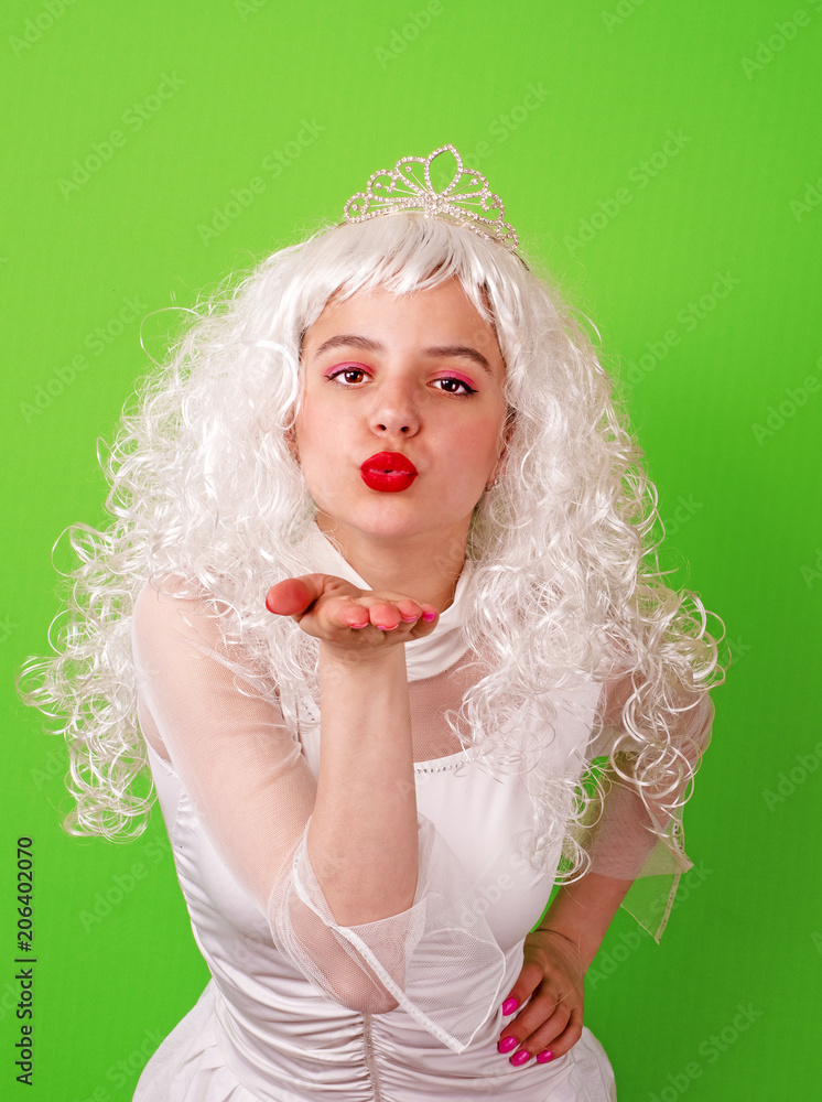 beautiful young girl with curly hairstyle. A gorgeous princess in a ...