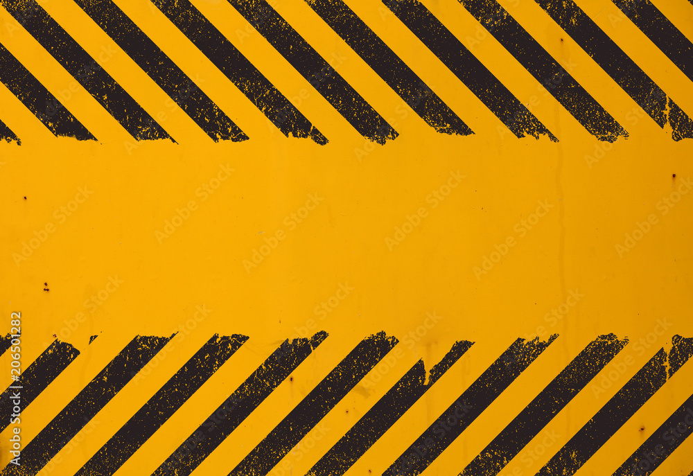 Yellow background with black grunge hazard sign Stock Photo | Adobe Stock