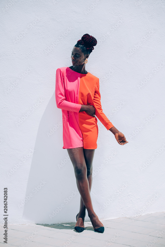 Exotic portrait of a beautiful and attractive black model woman wearing ...