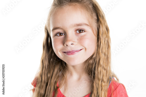 Portrait of a cute 7 years old girl Isolated over white background ...