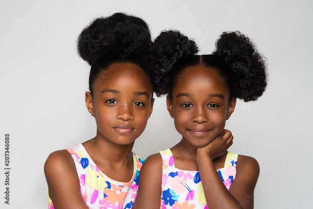 Studio portrait of two girls Stock Photo | Adobe Stock