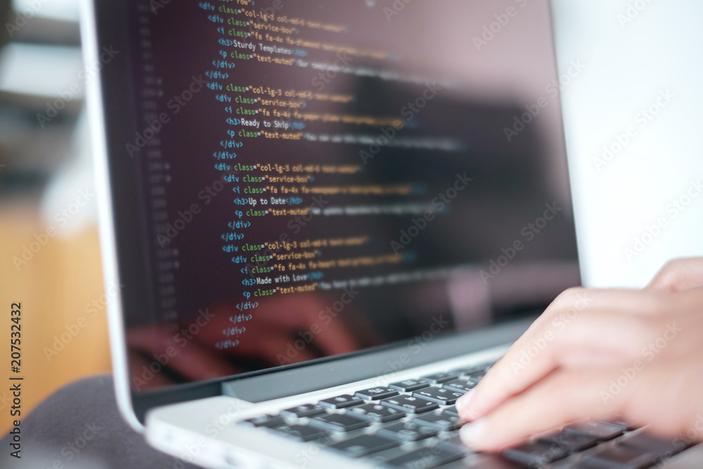 Closeup coding on screen, Woman hands coding html and programming on screen laptop, development ...