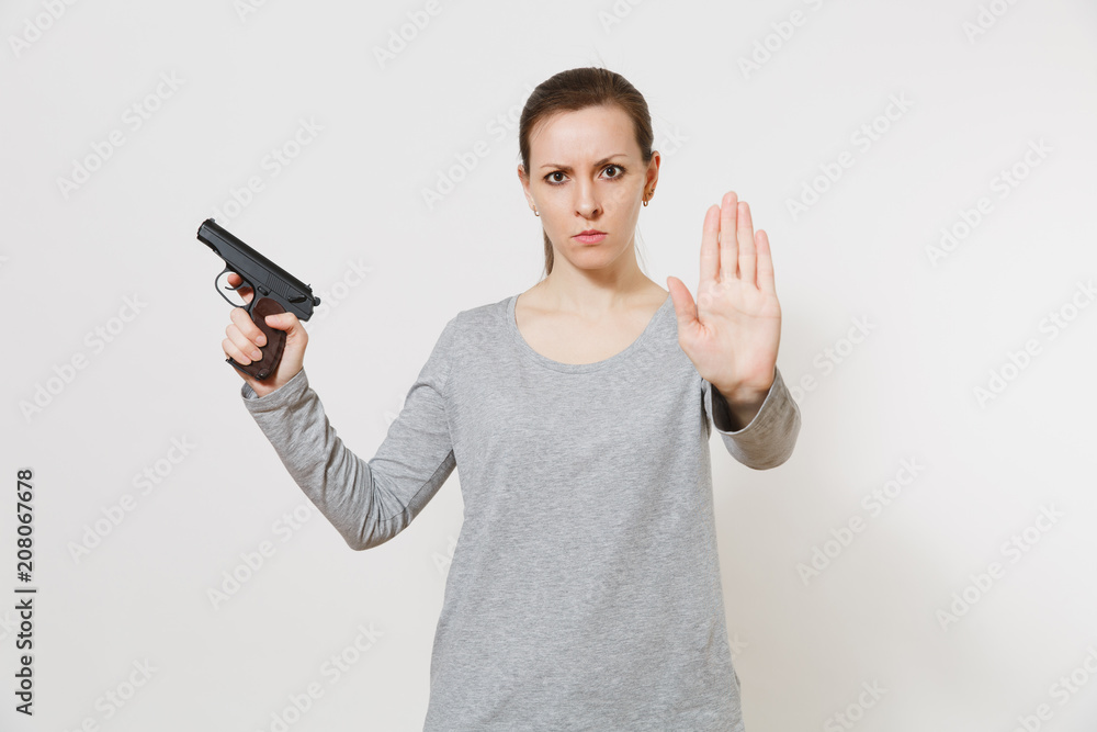 Photo Stock Woman with gun in hand showing stop gesture with palm ...