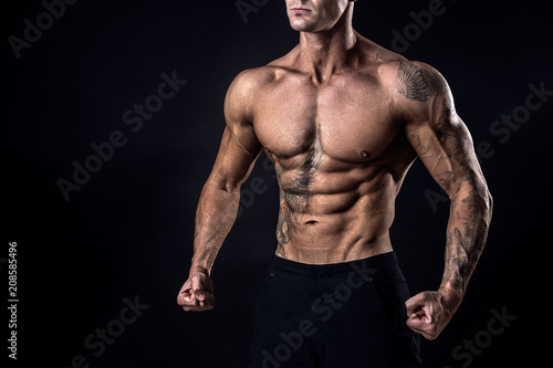 Unrecognizable Strong bodybuilder with six pack. Bodybuilder man with ...