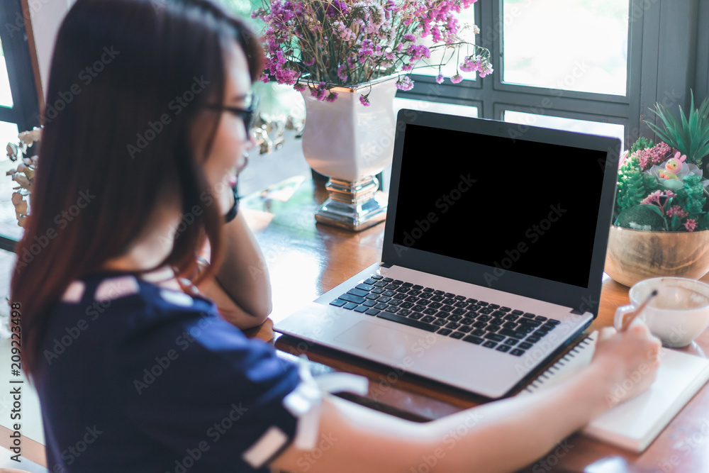 Business Asian woman hold pick up Smartphone make a note and working ...