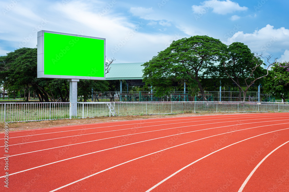 Digital blank scoreboard at football stadium with running track in ...