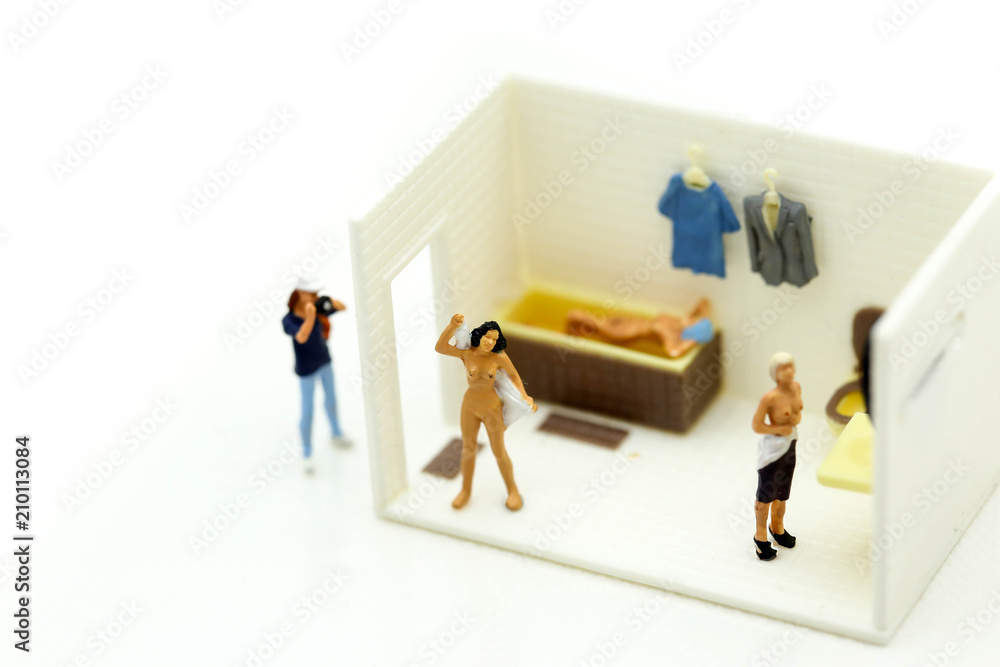 Miniature people : man is hiding behind bathroom Spying. Voyeurism with woman taking shower ...
