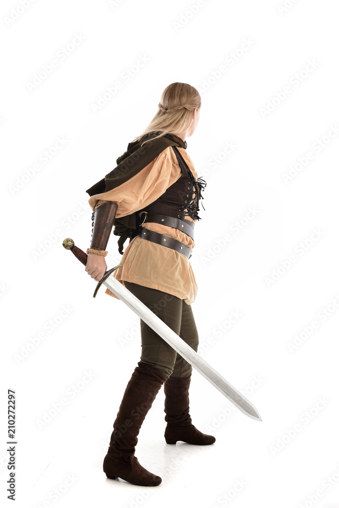 full length portrait of girl wearing medieval costume with sword ...