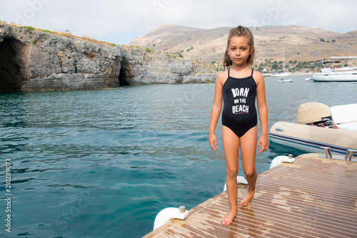 Cute Girl Is On The Boat With Her Swimwear She Is Born On The Beach