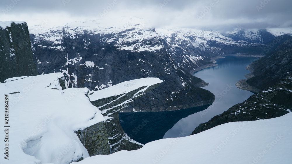 Trolltunga under snow, winter landscape of Troll Tongue, rock formation ...