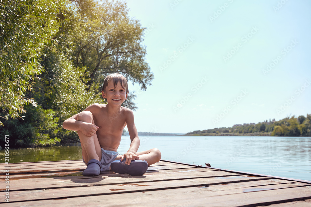 Young boy swimming and sunbathing during summer holidays Stock Photo ...
