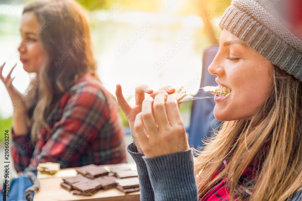 Attractive Young Adult Girl Eating Her Smore with Chocolate and Roasted ...