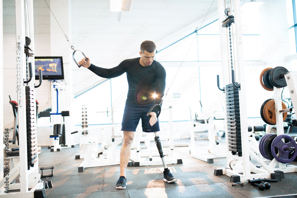 Full length portrait of handsome muscular man with prosthetic leg ...
