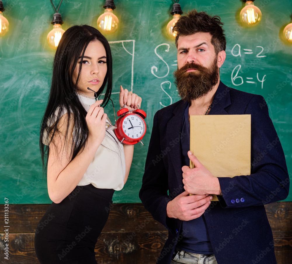 Discipline concept. Man with beard hold book and sexy girl teacher ...