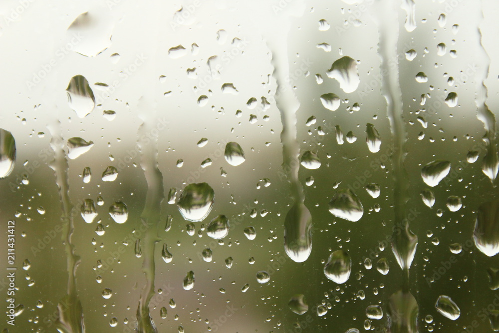 Wet, clear glass after the rain. Rain drops on the glass. Close-up ...