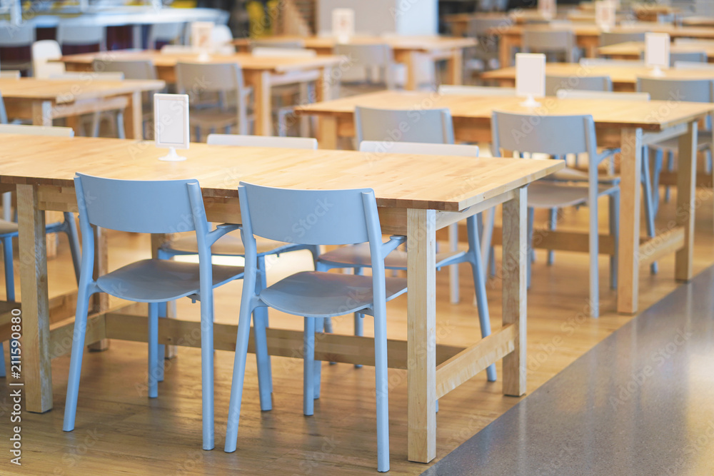 Interior of wooden table in food court shopping mall. Food center in ...