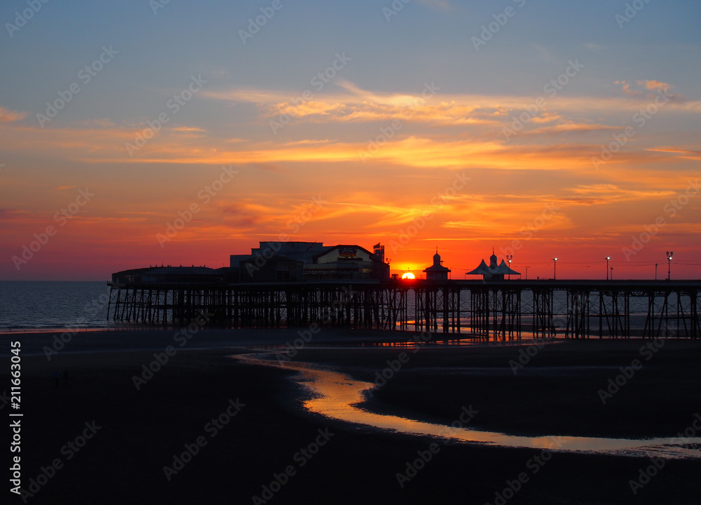 scenic view of blackpool north pier in glowing red evening light at ...