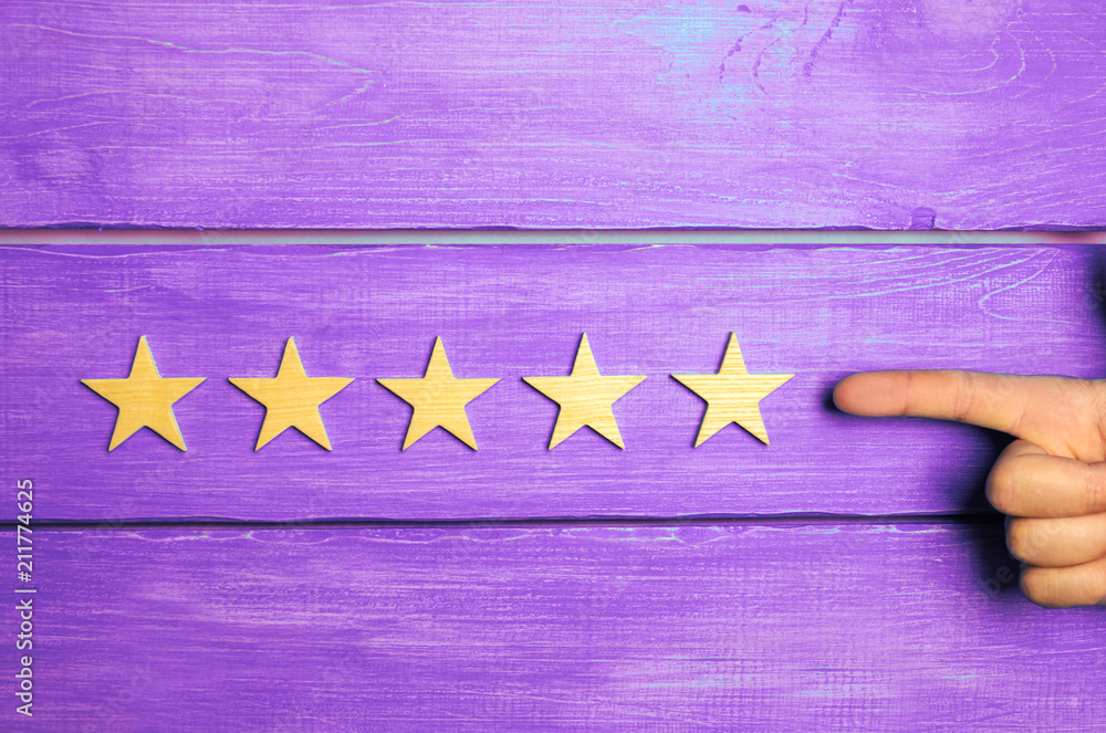 hand puts the fifth star. Quality status is five stars. A new star ...