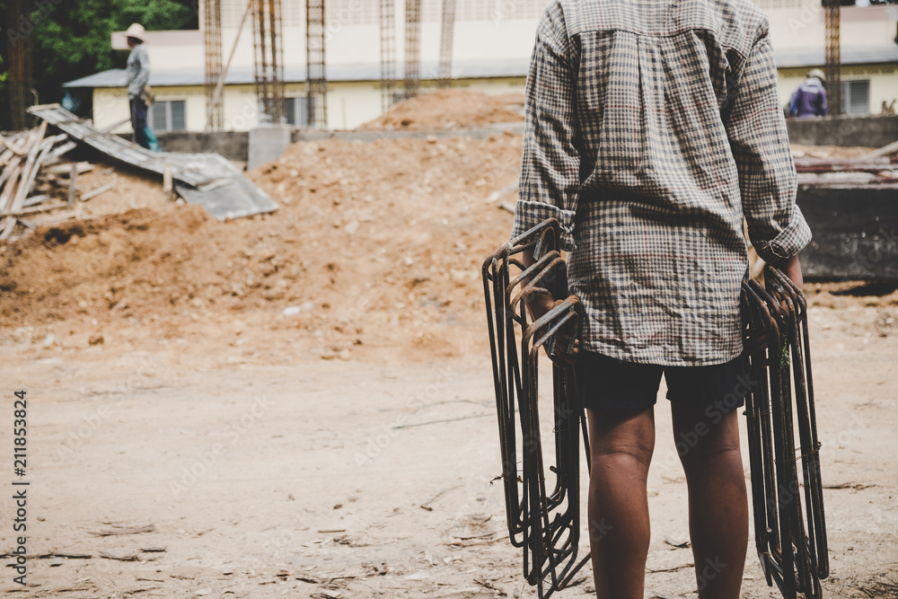 Little boy labor working in commercial building structure, World Day ...