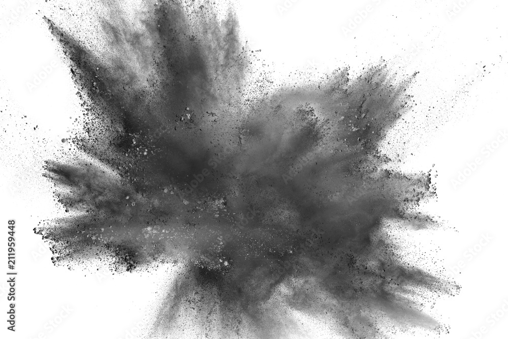 Black powder explosion against white background.Closeup of black dust ...