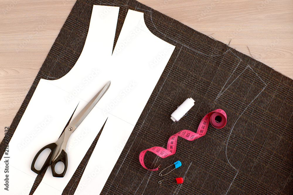 Sew out of checkered fabric. Checkered fabric, centimeter tape ...