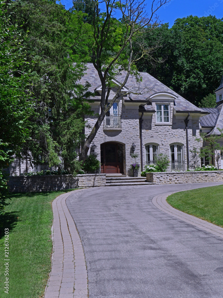 large house with long circular driveway Stock Photo | Adobe Stock