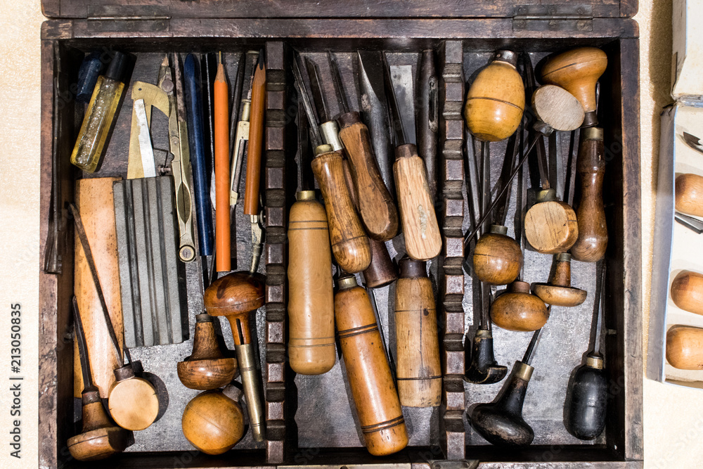 Antique tools for engraving and printing in a wooden case. Tools for ...