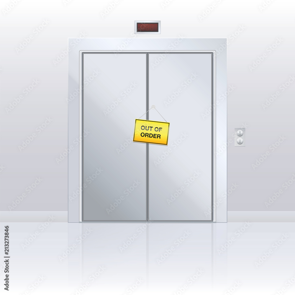 Out of order sign on elevator door. Yellow warning panel hanging on ...