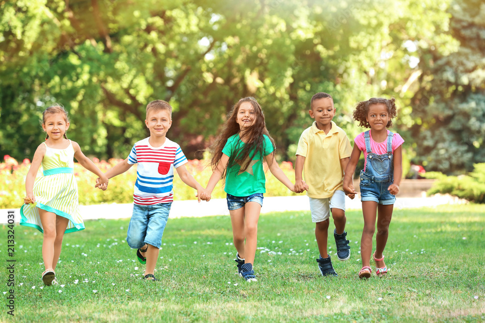 Cute little children playing in park Stock Photo | Adobe Stock