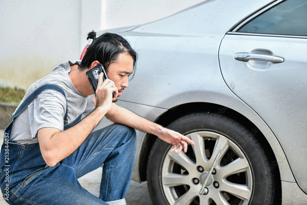 Car Repair Concept. Asian people are repairing cars on the roadside ...